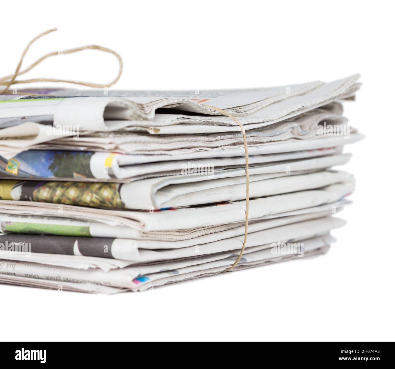 Pile of stacked generic folded newspapers on white background Stock ...