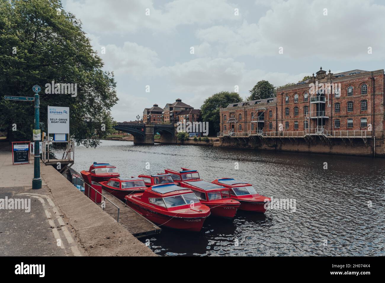 York, UK - June 22, 2021: Self-drive red hire boat moored on a River ...