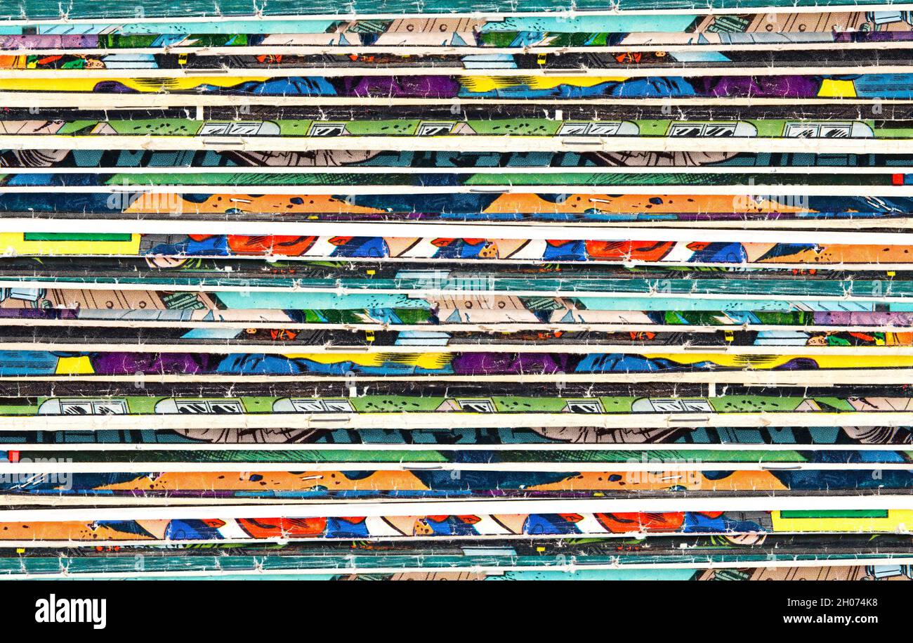 Old comic books with faded pages stacked in a pile background texture ...