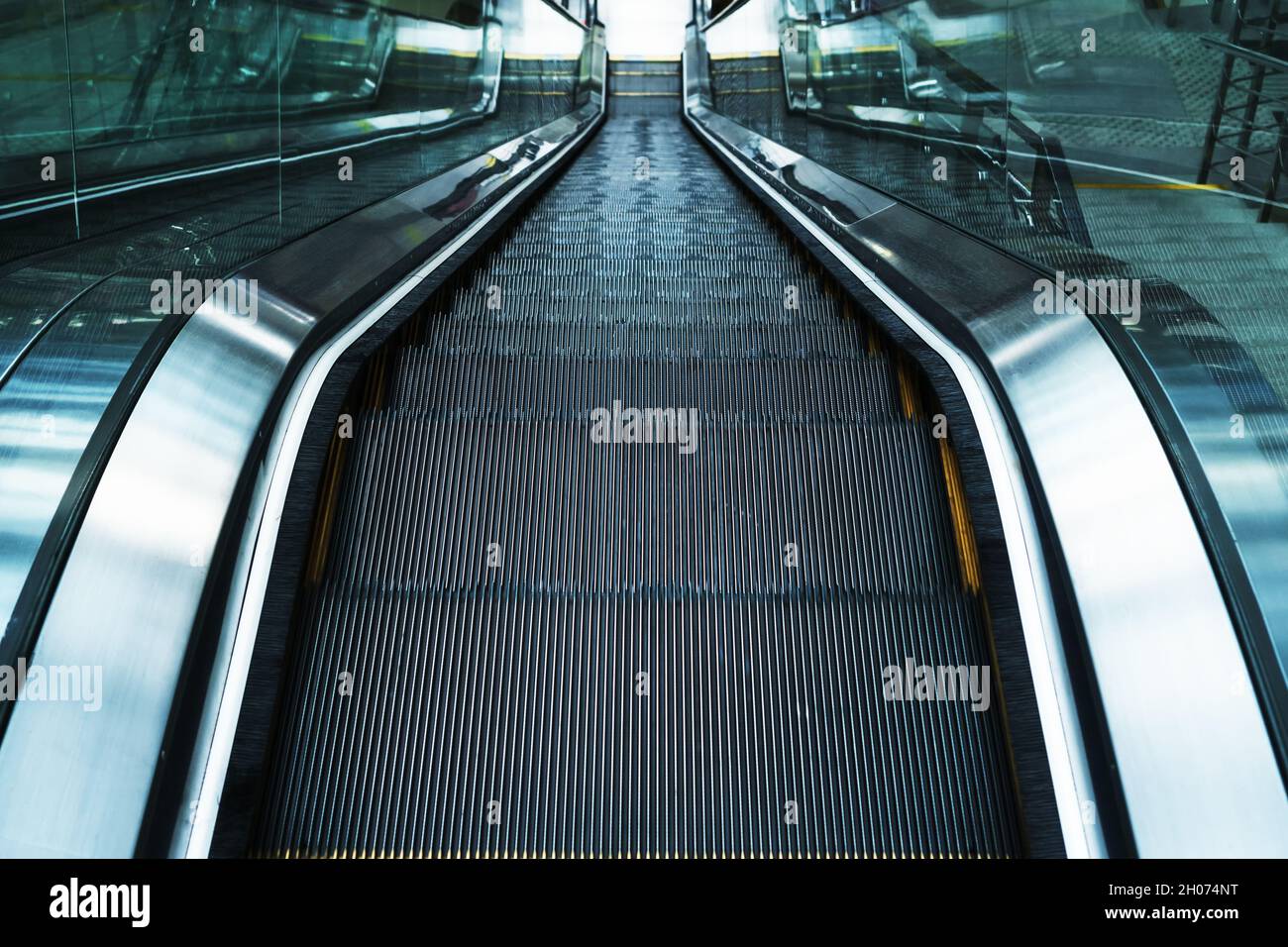 The steps of the escalator descent in the waiting rooms of the station ...