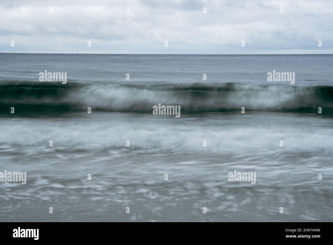 stormy weather with breaking of waves at the beach Stock Photo - Alamy