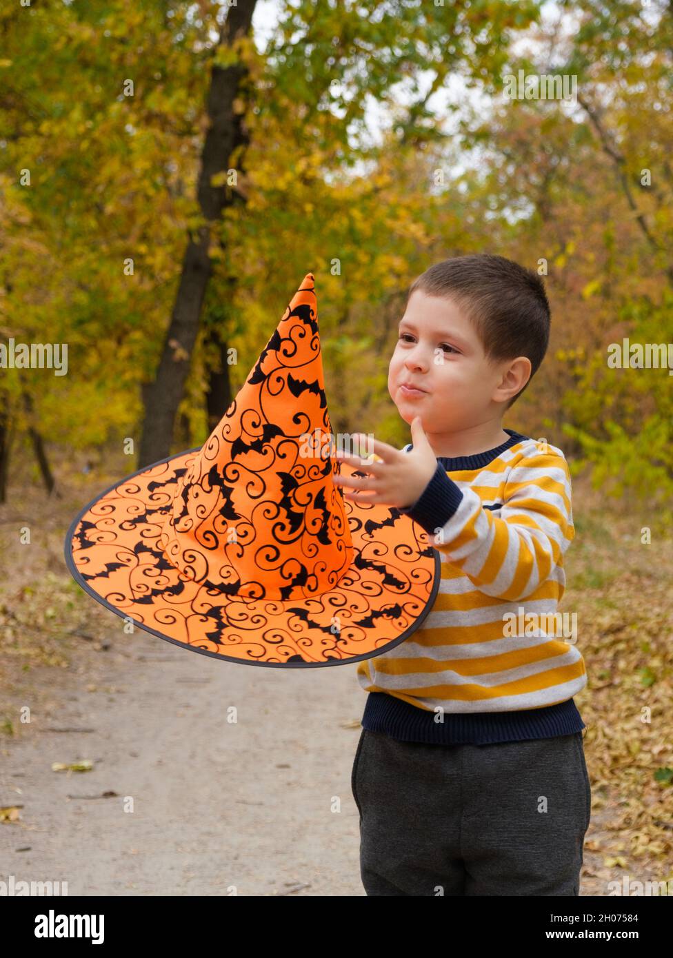 Put on hat child hi-res stock photography and images - Alamy