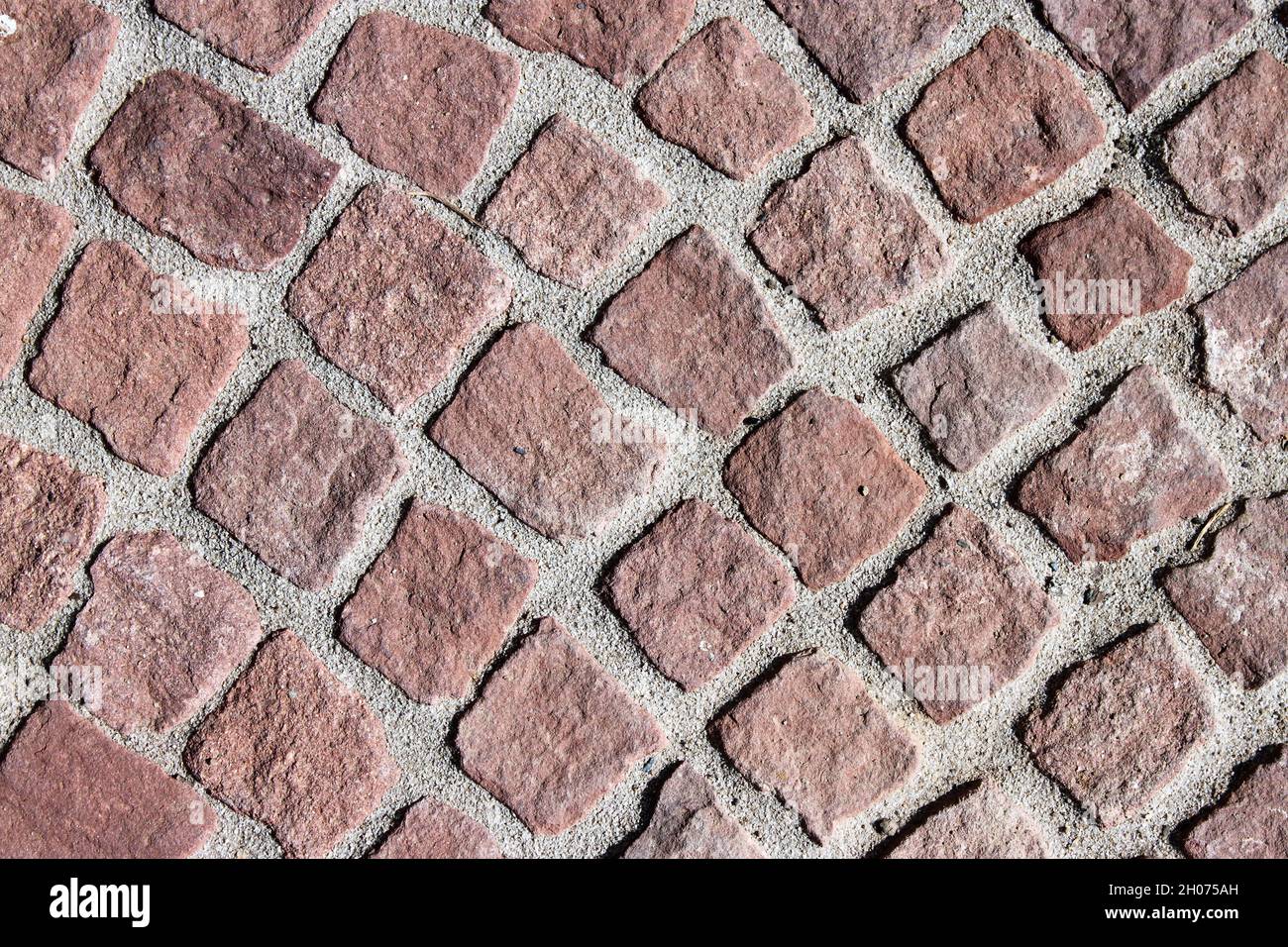 picture of a red cobblestone sidewalk Stock Photo - Alamy