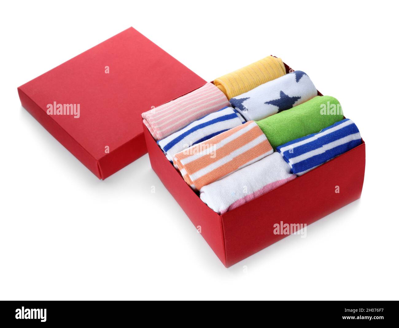 Box of child socks on white background Stock Photo - Alamy