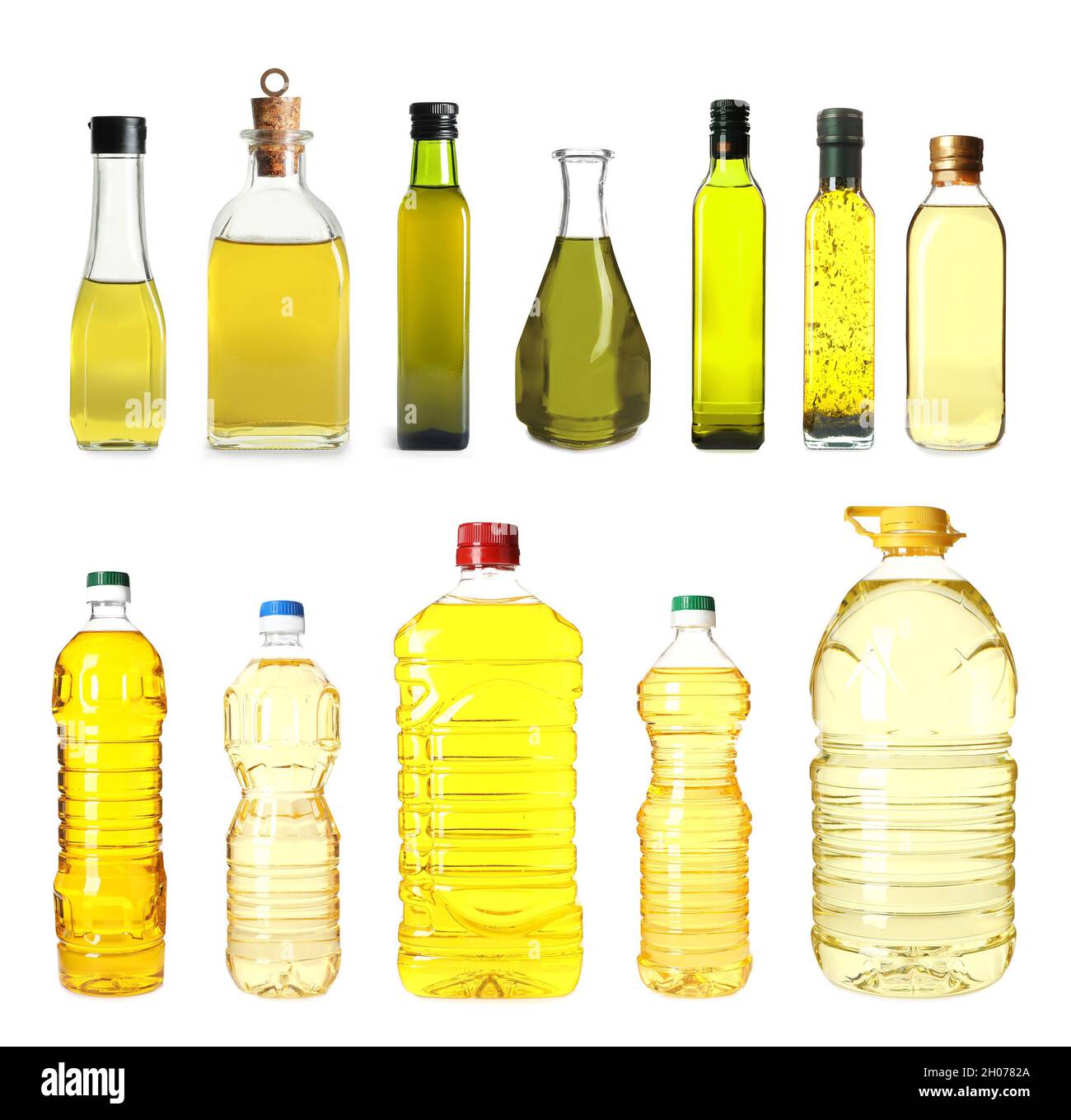 Set with bottles of different oils on white background Stock Photo - Alamy