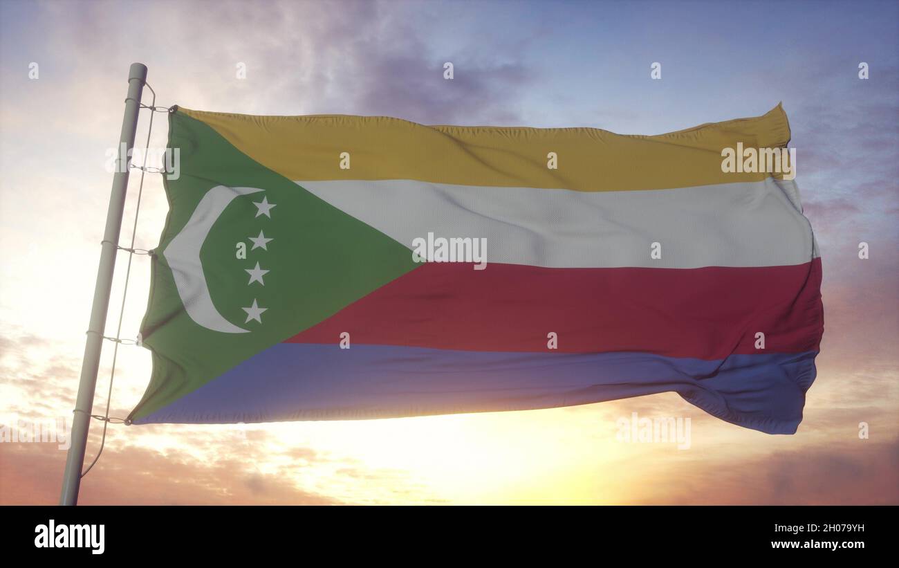 Flag of Comoros waving in the wind, sky and sun background. 3d ...
