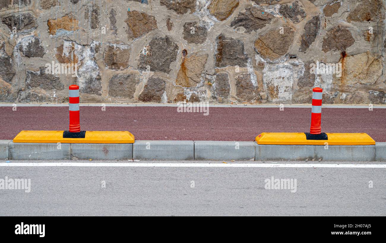 Bike lanes physical protection from car traffic safety post Stock Photo ...