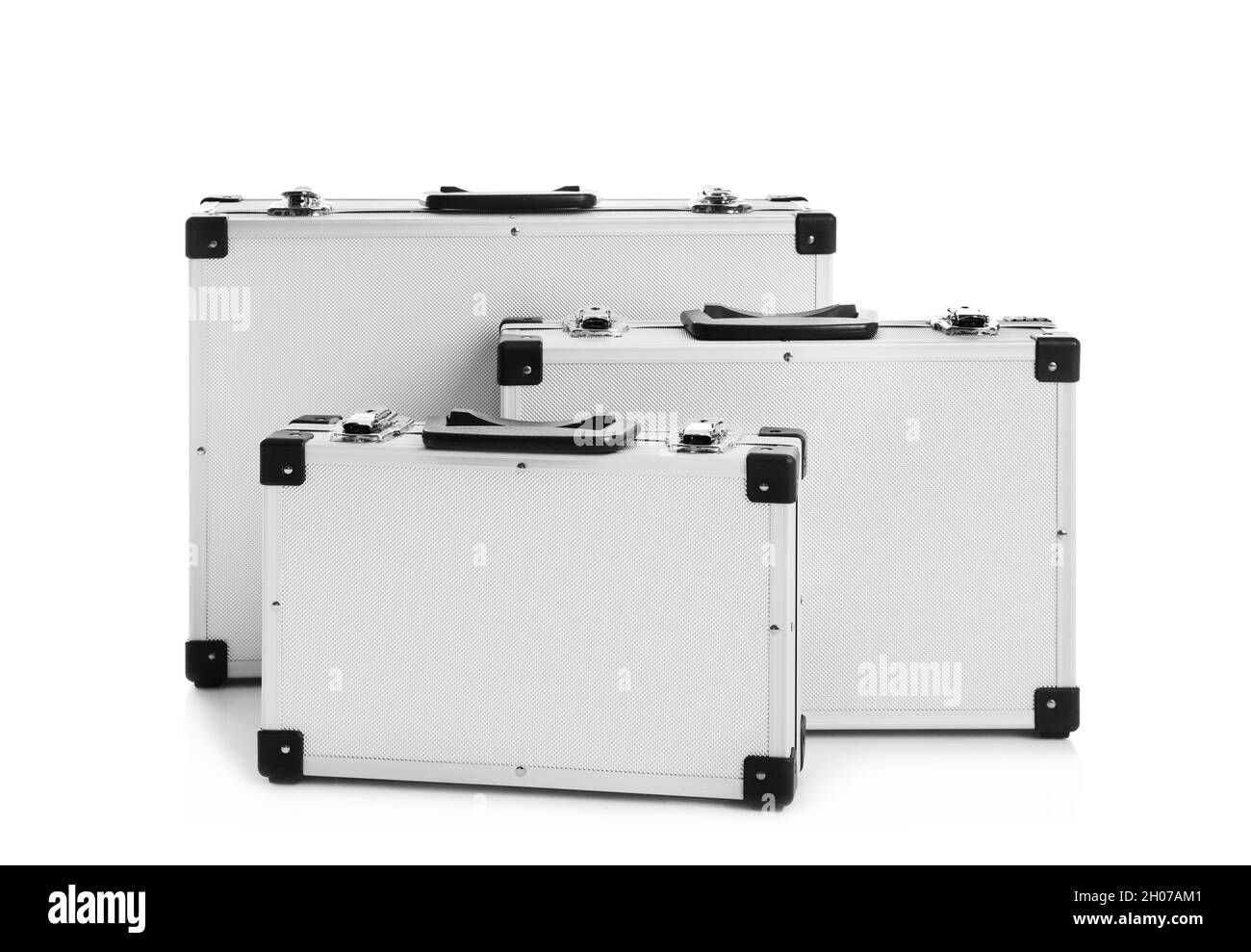 Set of modern suitcases on white background Stock Photo - Alamy