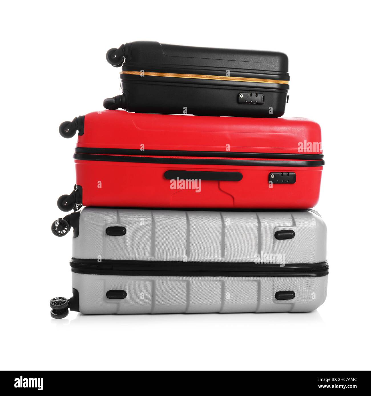 Modern suitcases for travelling on white background Stock Photo - Alamy