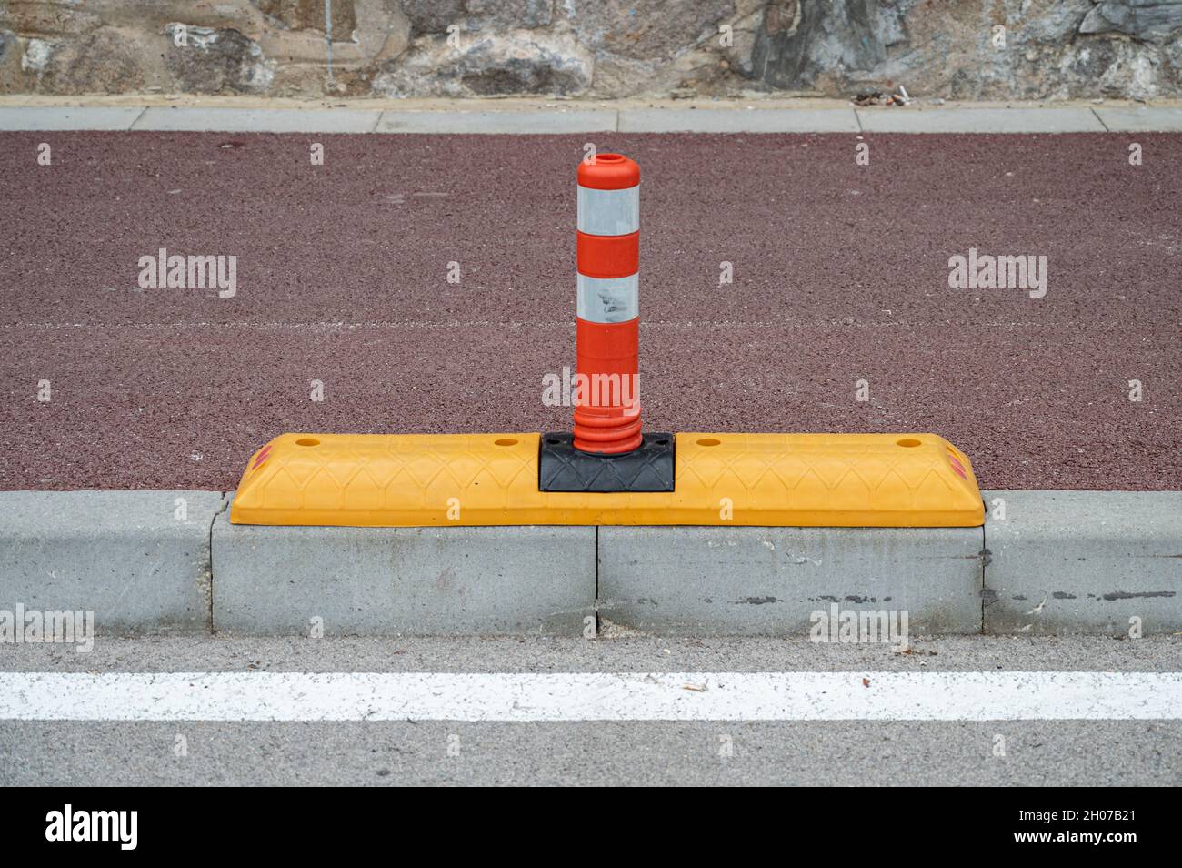 Bike lanes physical protection from car traffic safety post Stock Photo ...