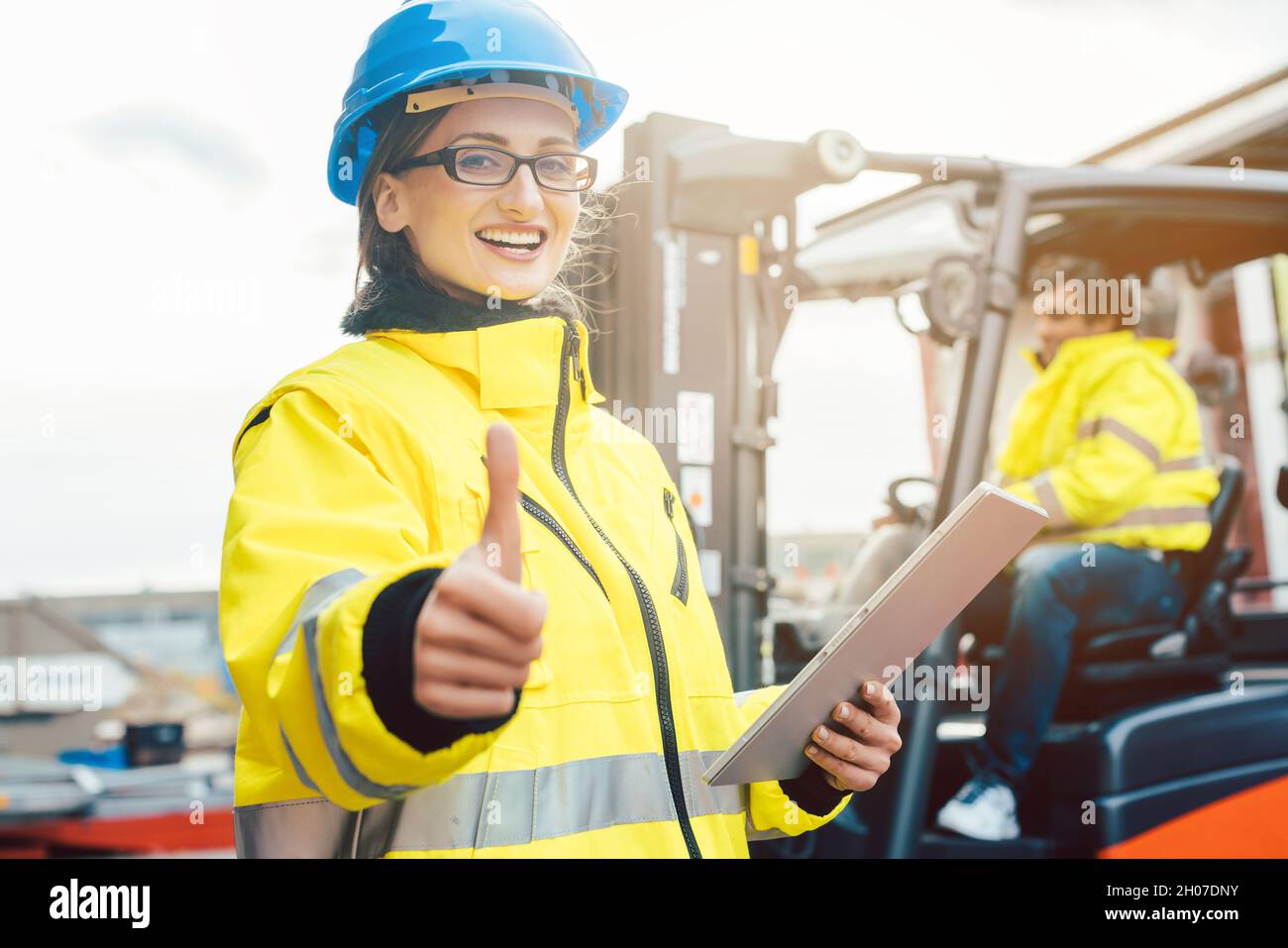 Workers in the logistics industry having a success Stock Photo - Alamy