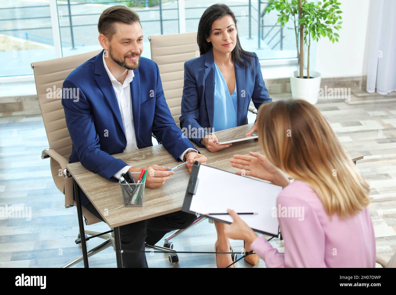 Human resources commission conducting job interview with applicant in office Stock Photo - Alamy