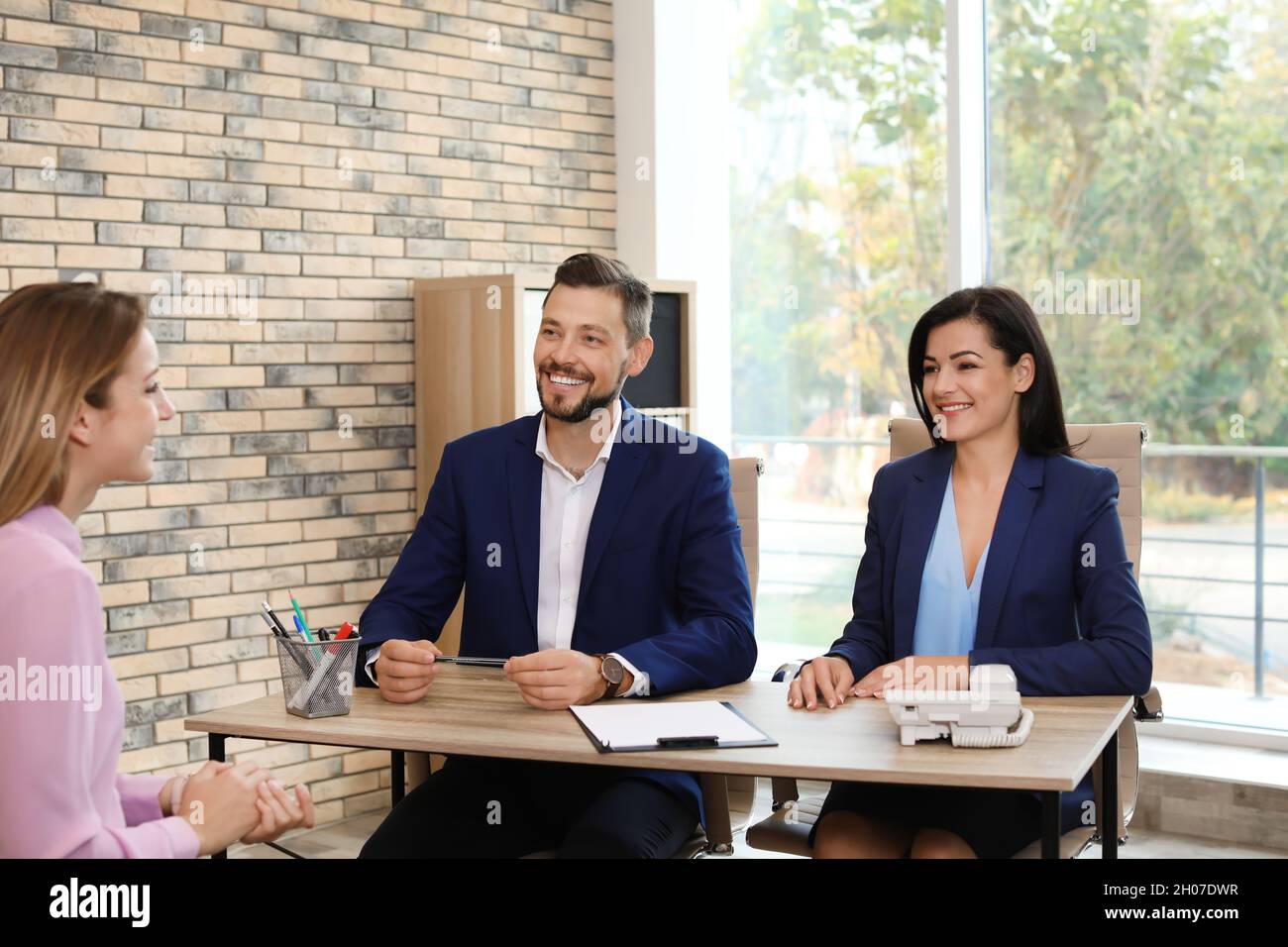 Human resources commission conducting job interview with applicant in office Stock Photo - Alamy