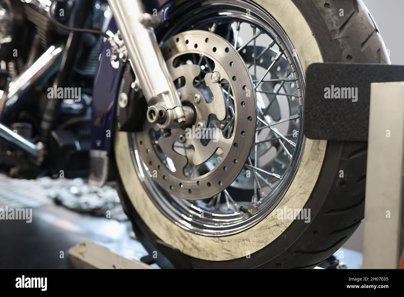 Front motorcycle wheel with shiny brake disc closeup Stock Photo - Alamy