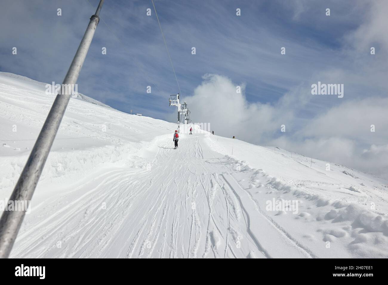 Ski lift pulling Stock Photo - Alamy