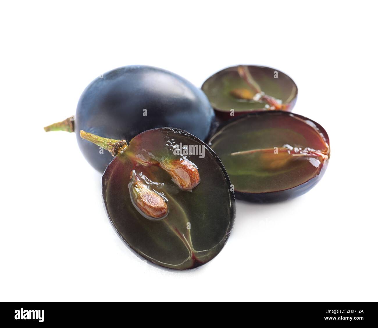 Cut and whole fresh ripe juicy grapes with seeds on white background ...