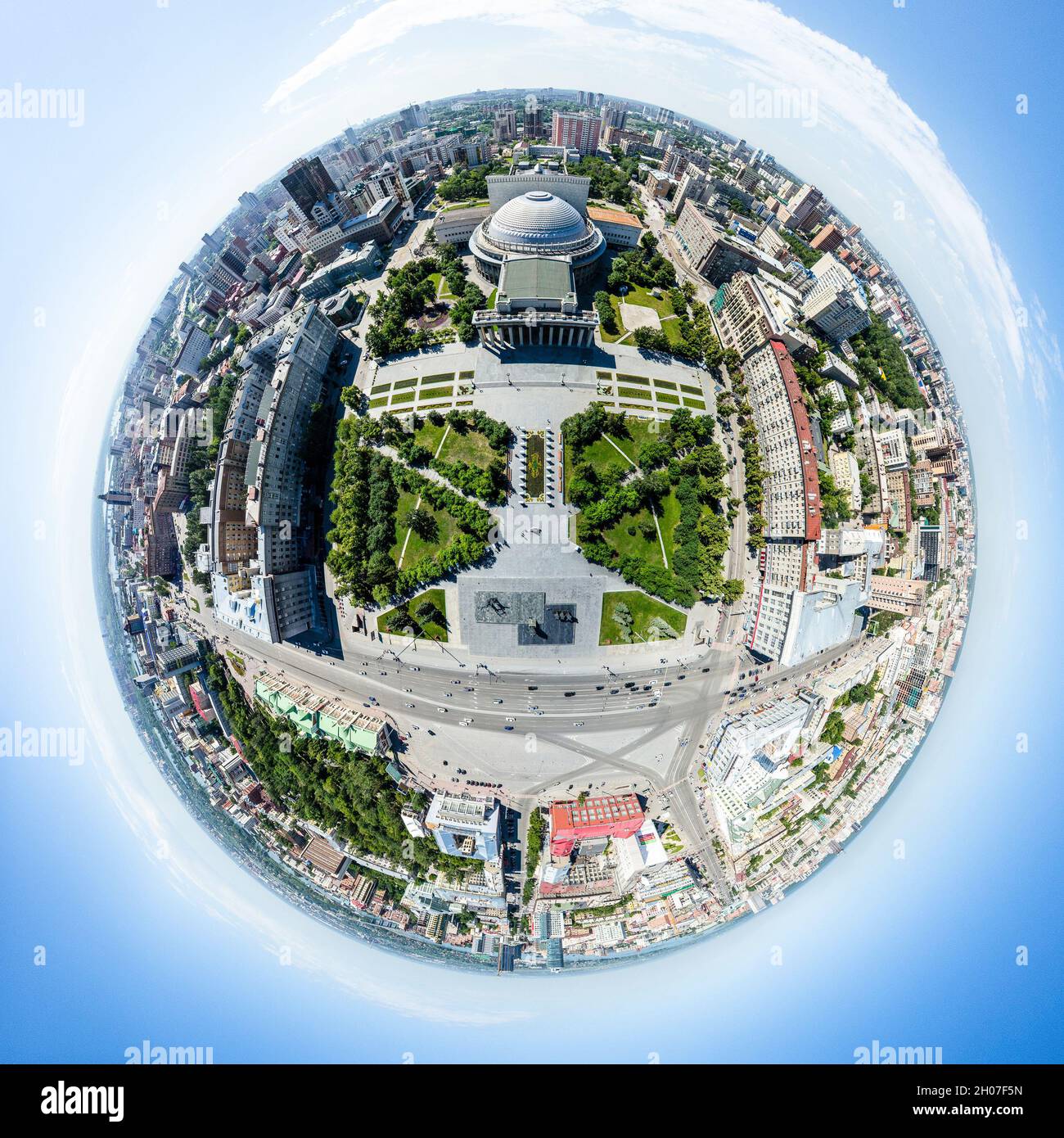 Aerial city view with crossroads, roads, houses, buildings, parks and ...