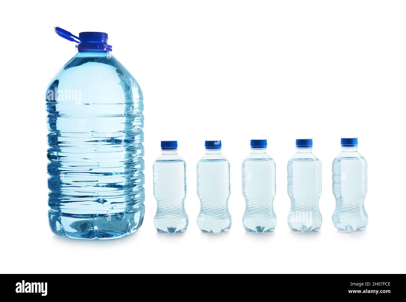 Large and small bottles of water on white background Stock Photo - Alamy