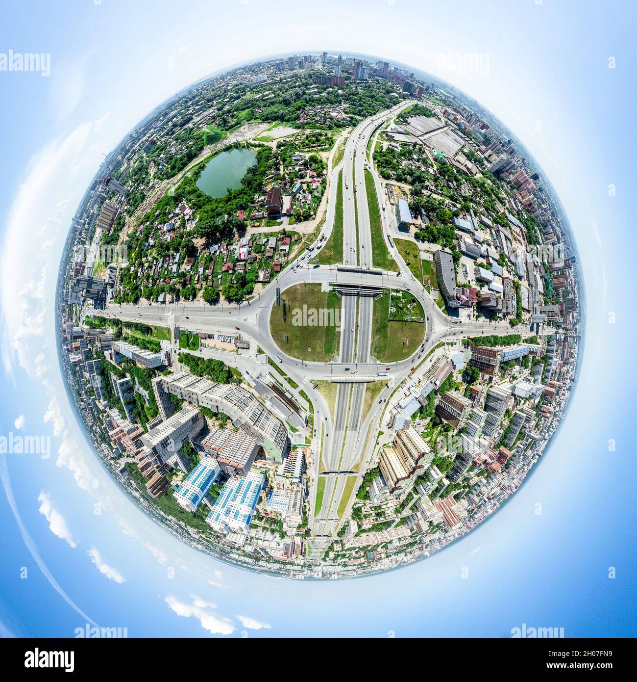 Aerial city view with crossroads and roads, houses, buildings, parks ...