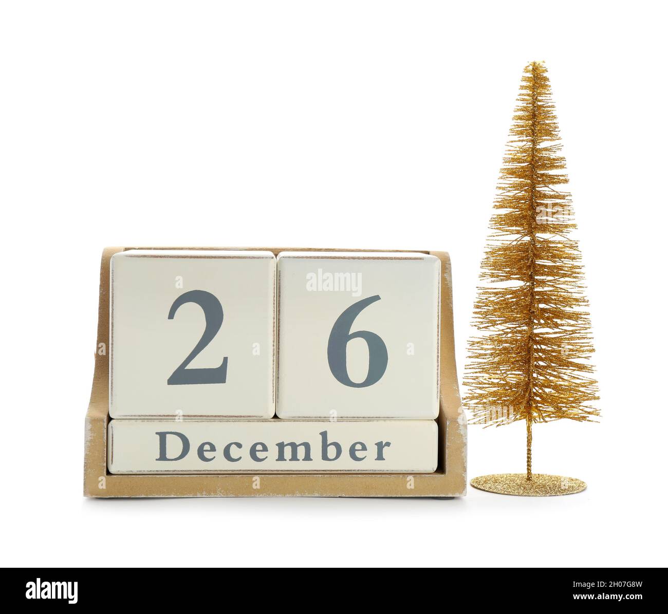 Wooden block calendar and decorative fir tree on white background ...