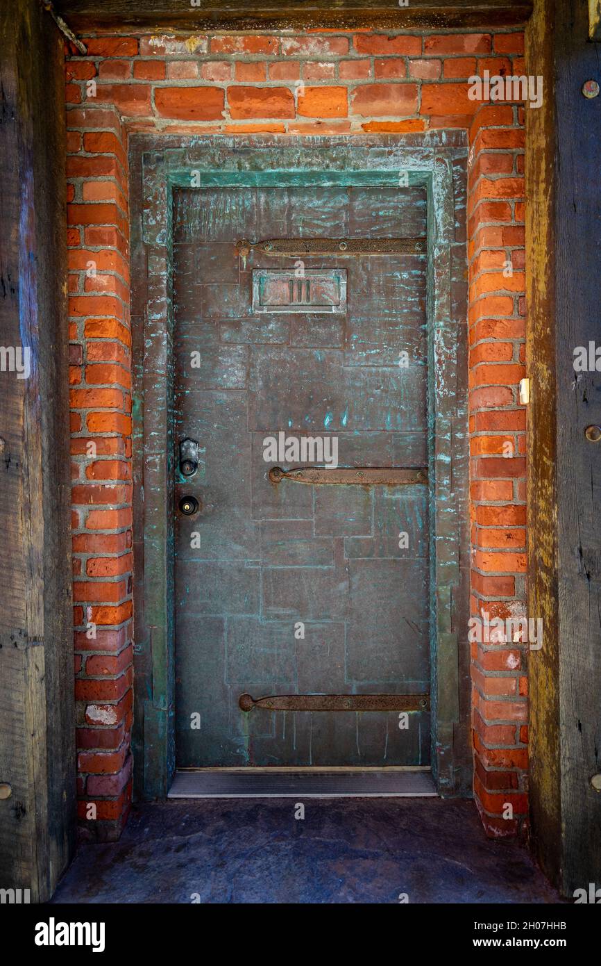Heavy Copper Door with green oxidation entry to old brick building good ...