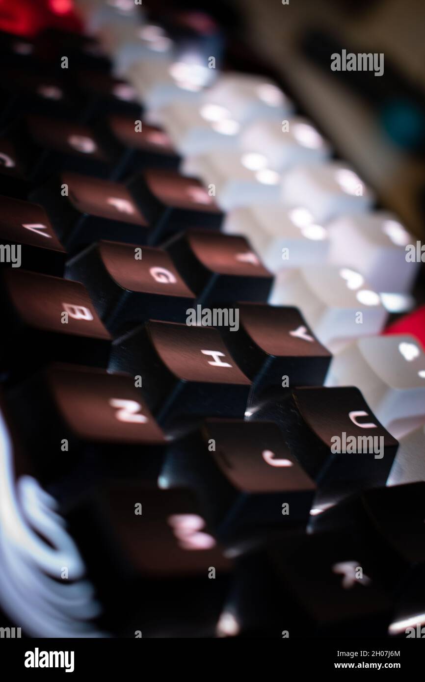 White Backlit Mechanical Keyboard with black, white, red keycaps at an ...