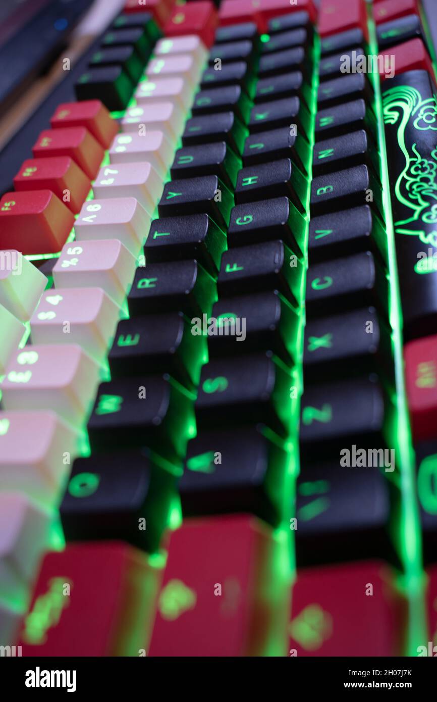 Green Backlit Mechanical Keyboard with black, white, red keycaps at an ...