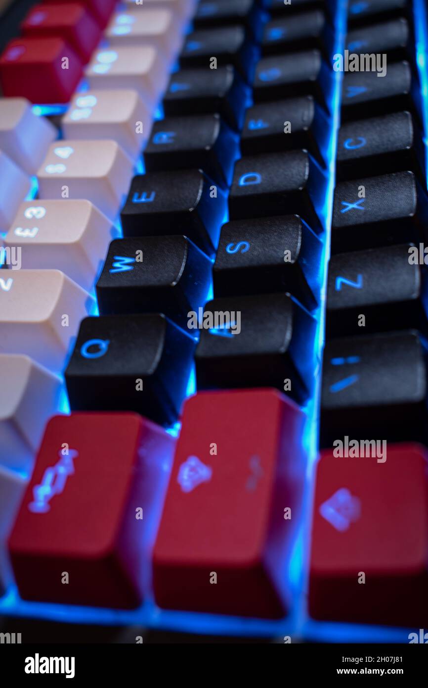 Blue Backlit Mechanical Keyboard with black, white, red keycaps at an ...