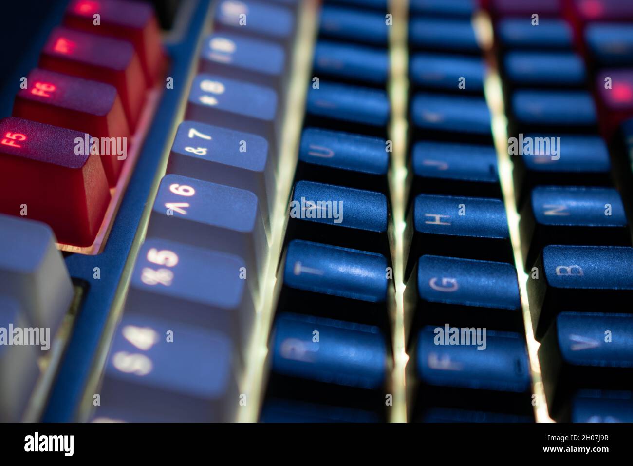Yellow Backlit Mechanical Keyboard with black, white, red keycaps at an ...
