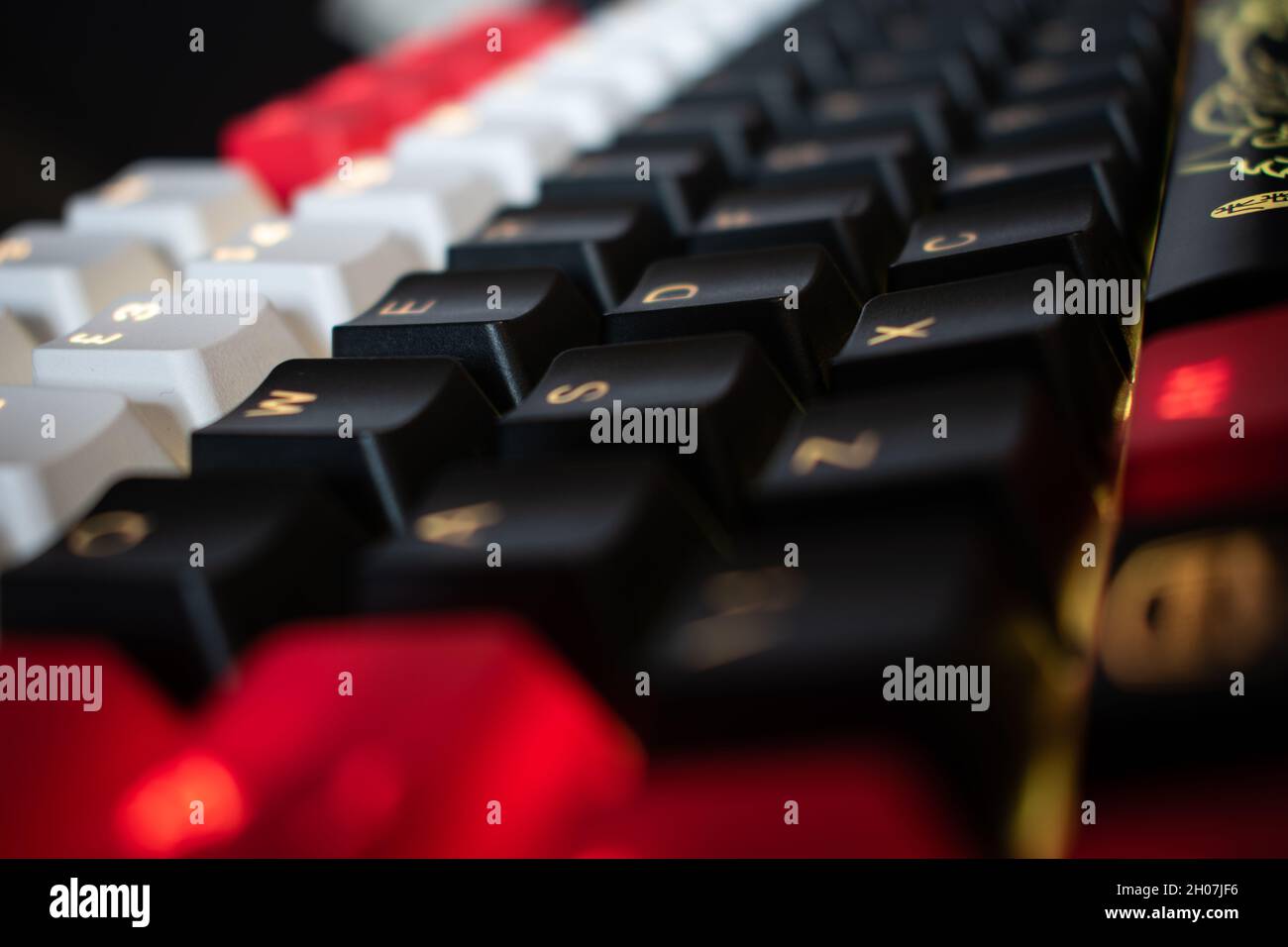 Golden Backlit Mechanical Keyboard with black, white, red keycaps at an ...