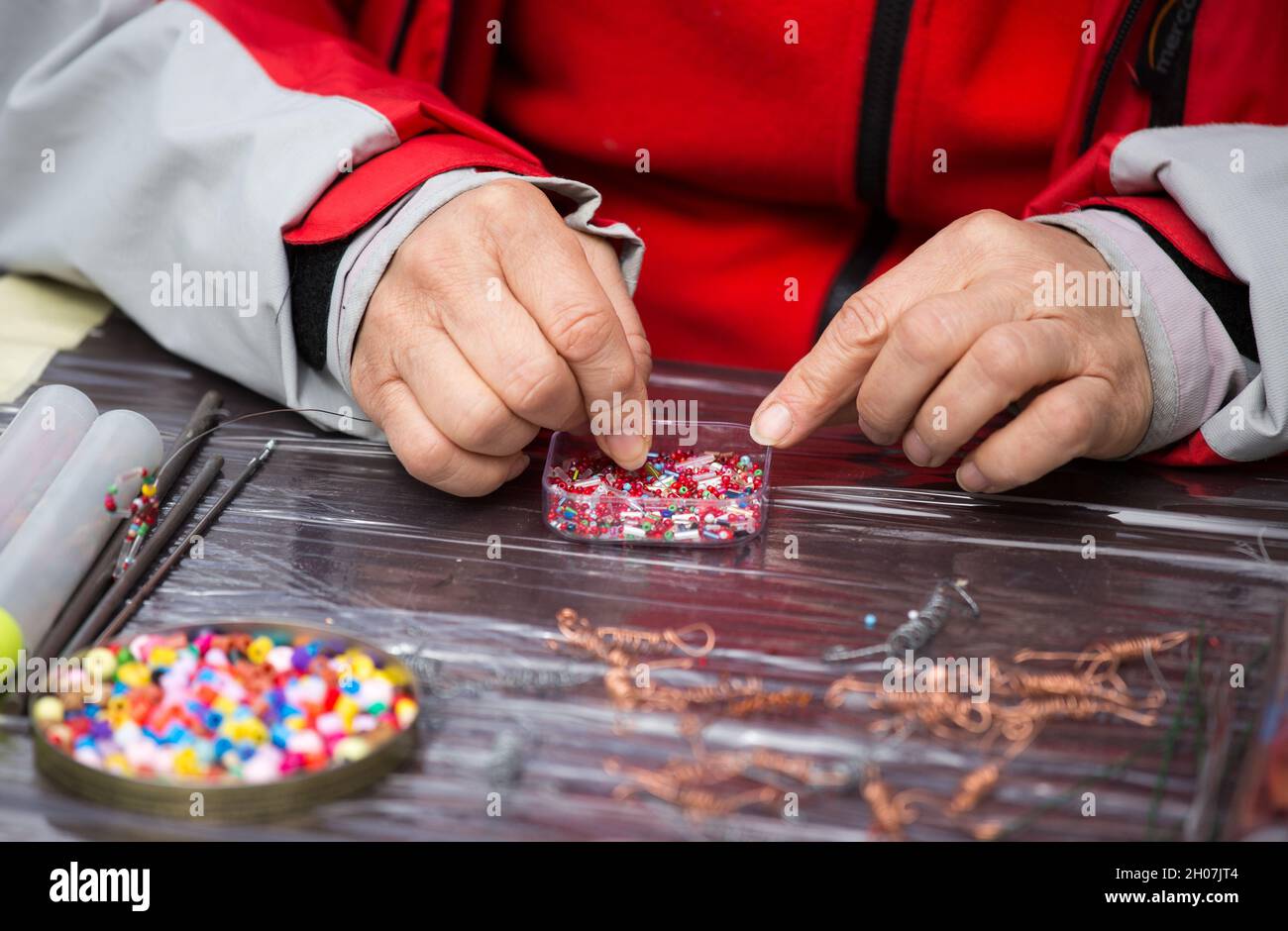 Woman hands making beads hi-res stock photography and images - Alamy