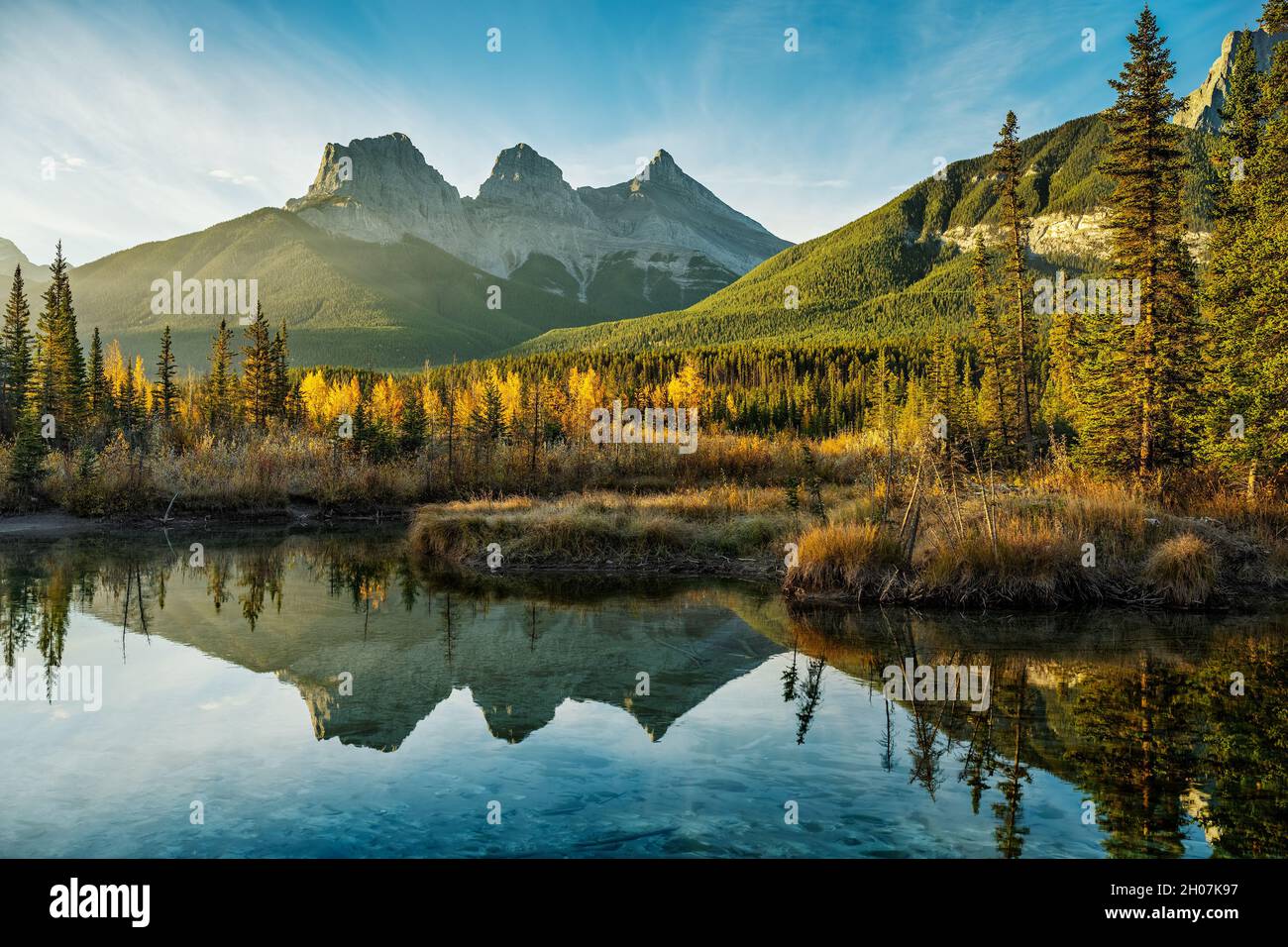 Sunrise over the Three Sisters that is reflecting in Policeman Creek ...