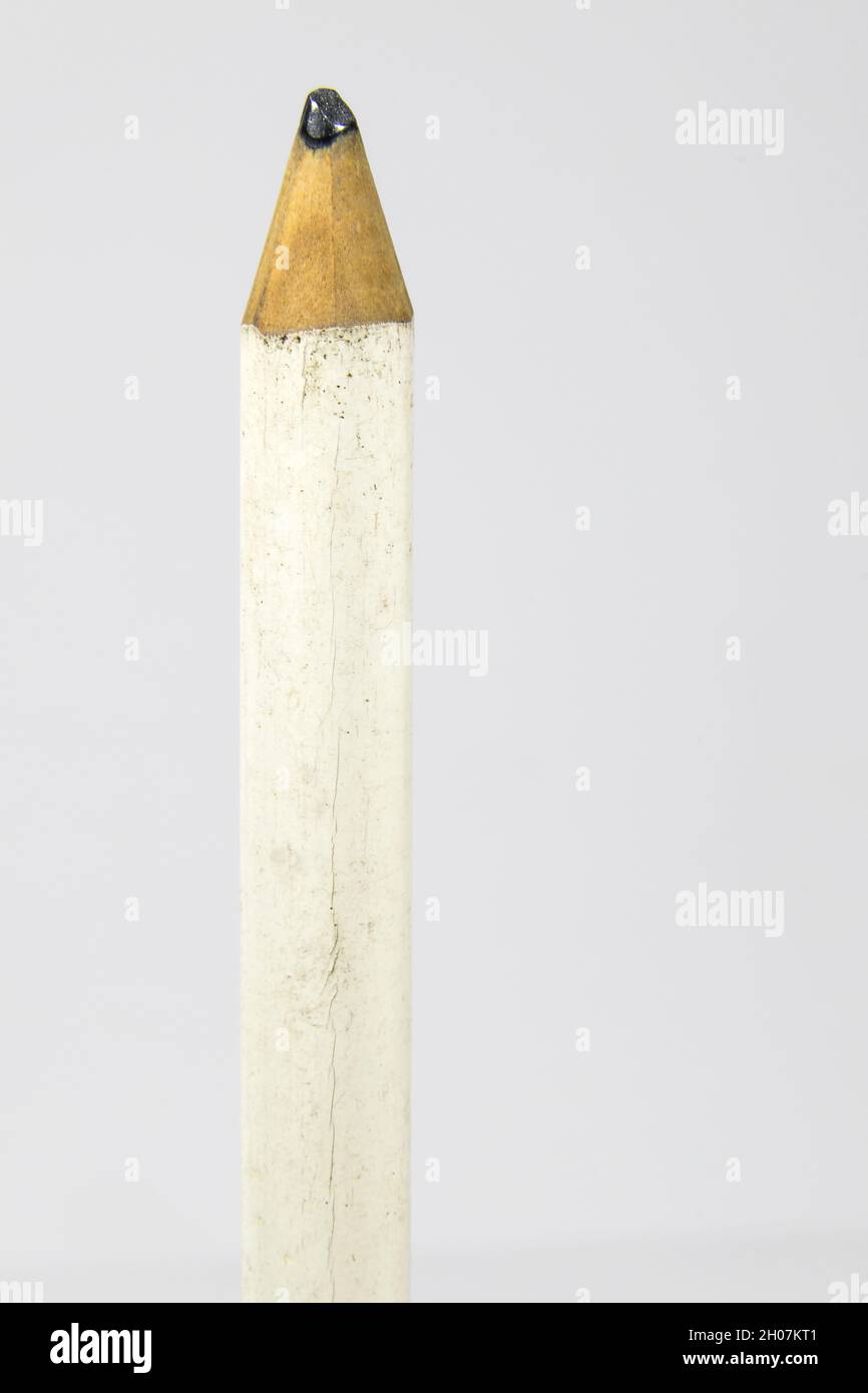 White pencil with sharp tip Stock Photo - Alamy