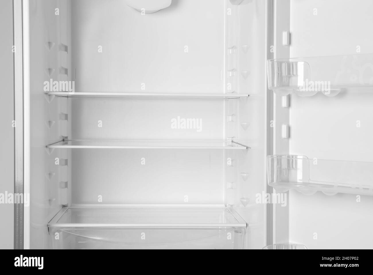 Modern open refrigerator with empty shelves, closeup Stock Photo - Alamy