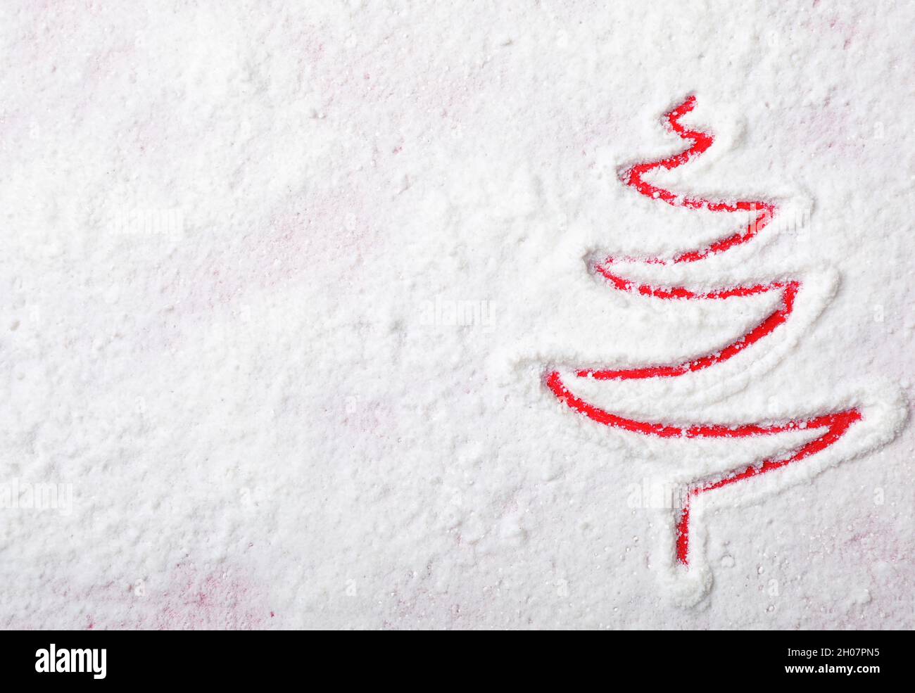 Christmas tree silhouette in snow on color background, top view with ...
