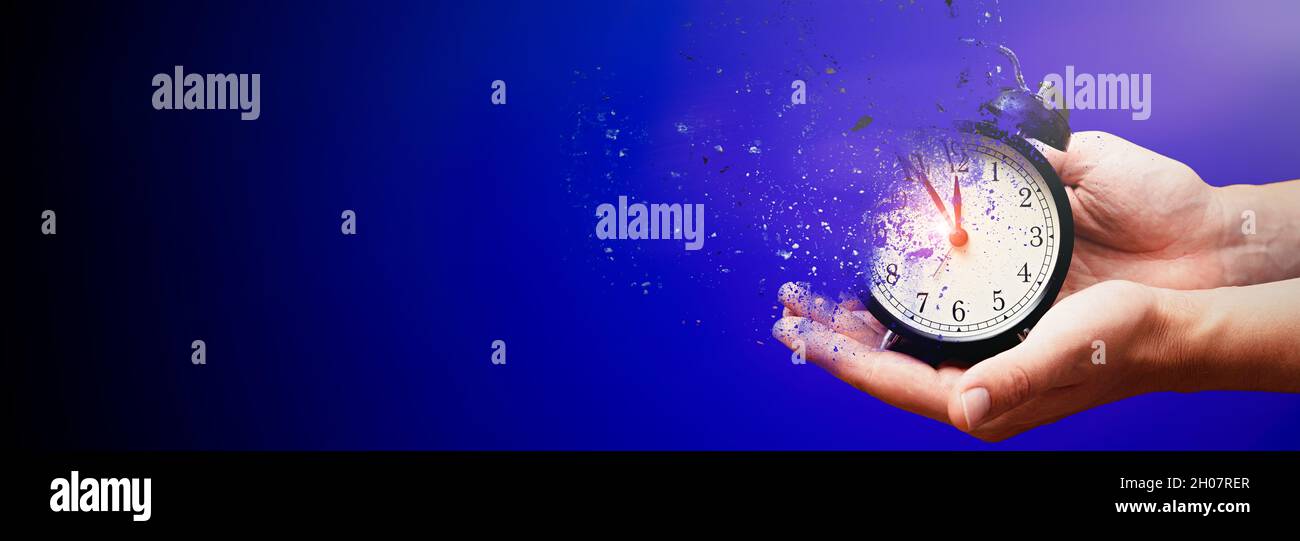 Concept of passing away, the clock breaks down into pieces. Hand ...