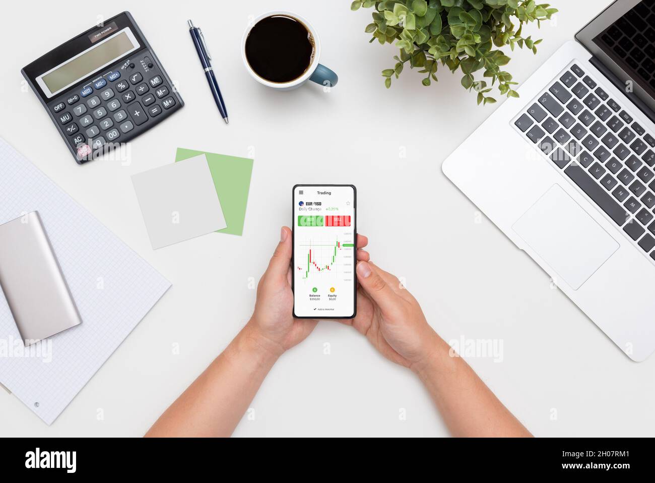 Invevstor using mobile trader app. Stock market, investment concept ...