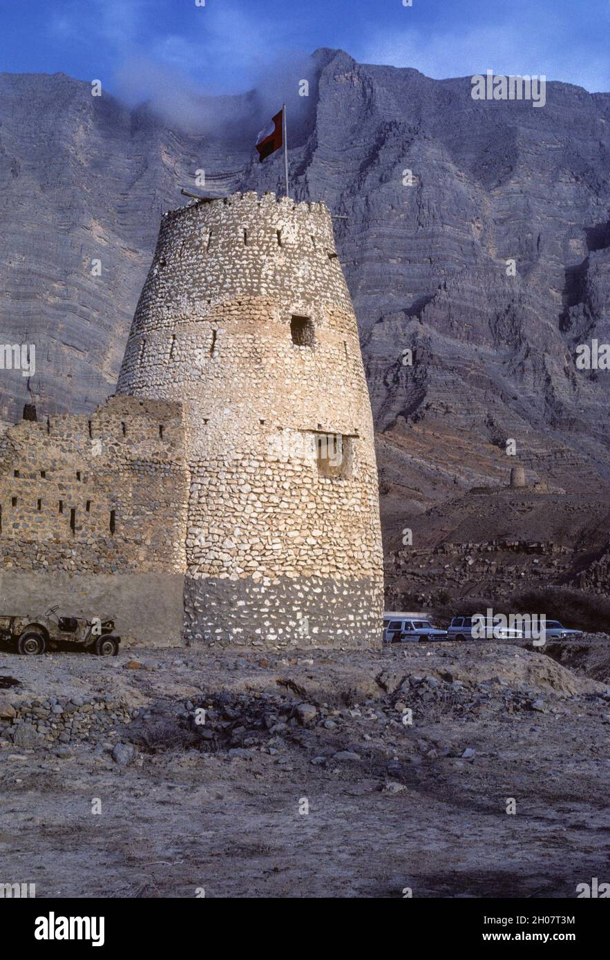 Bukha, Oman. Bukha Fort in 1985, prior to restoration. Al-Qala Tower on ...