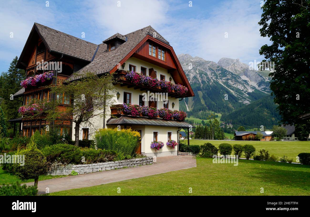 a rustic house with geraniums on the windowsill in the Schladming ...