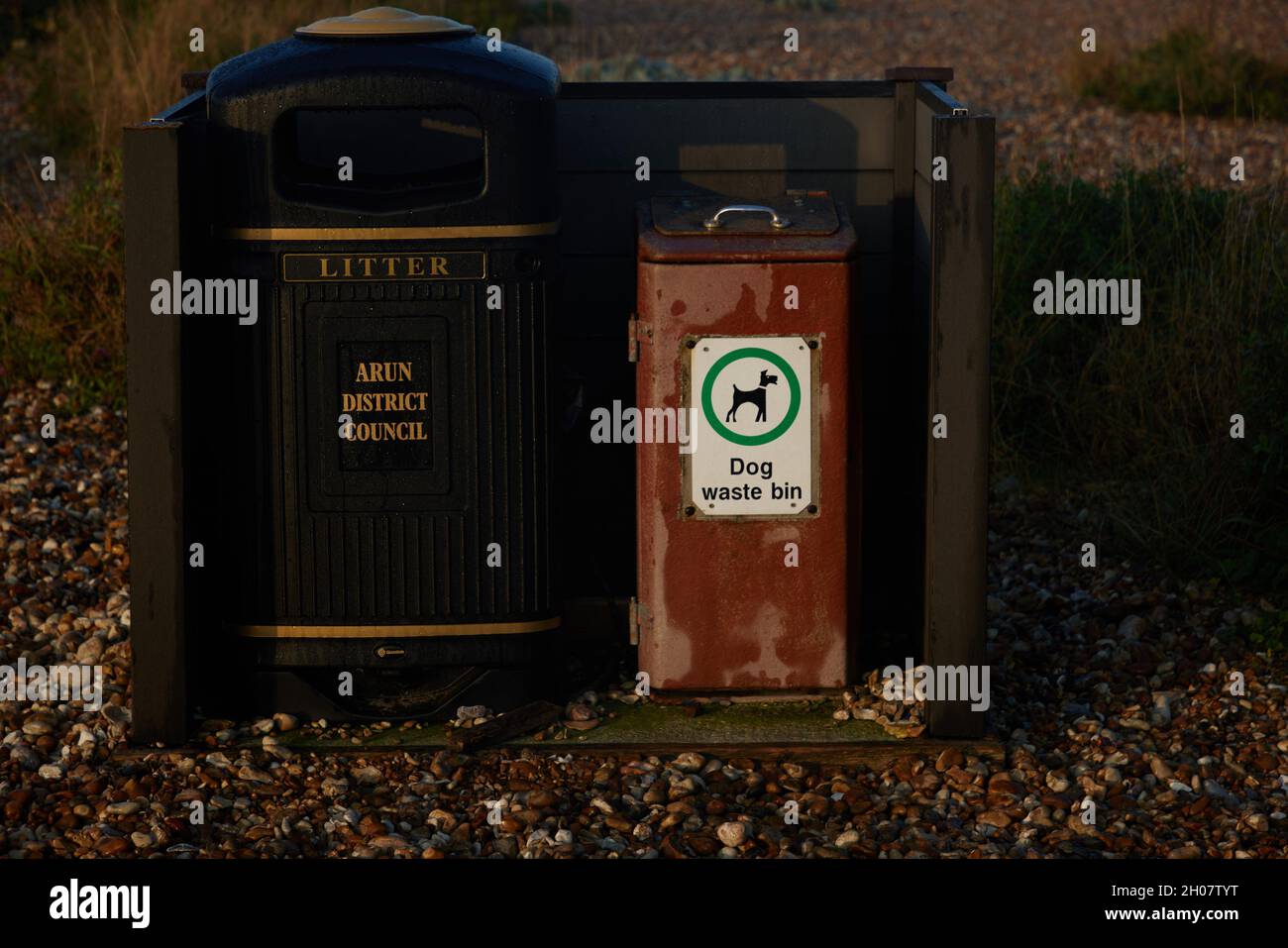 Exterior view of a litter bin and a dog wast bin side by side in an ...