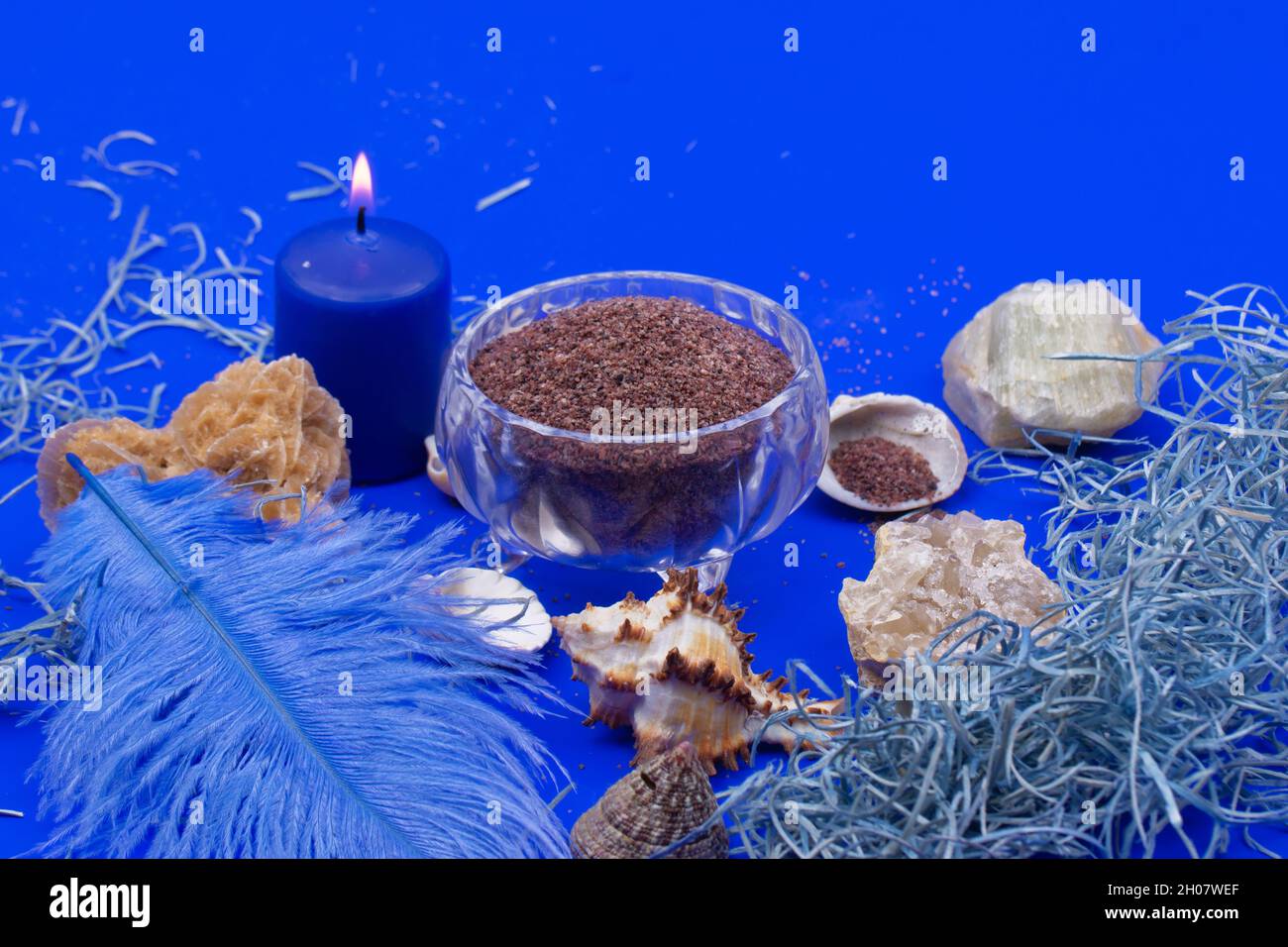 Spa products with sea shells and salt on blue background. Beauty ...
