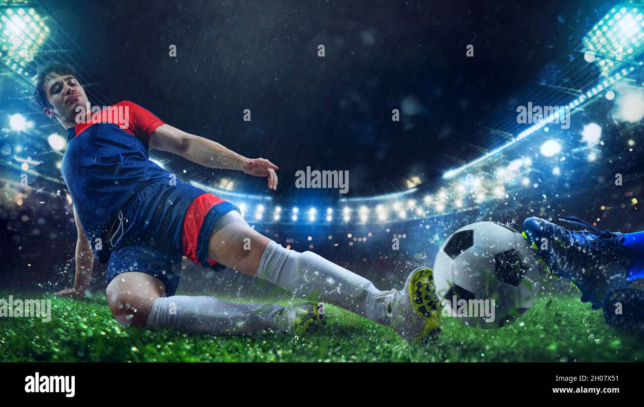 Football scene with competing football players at the stadium Stock ...