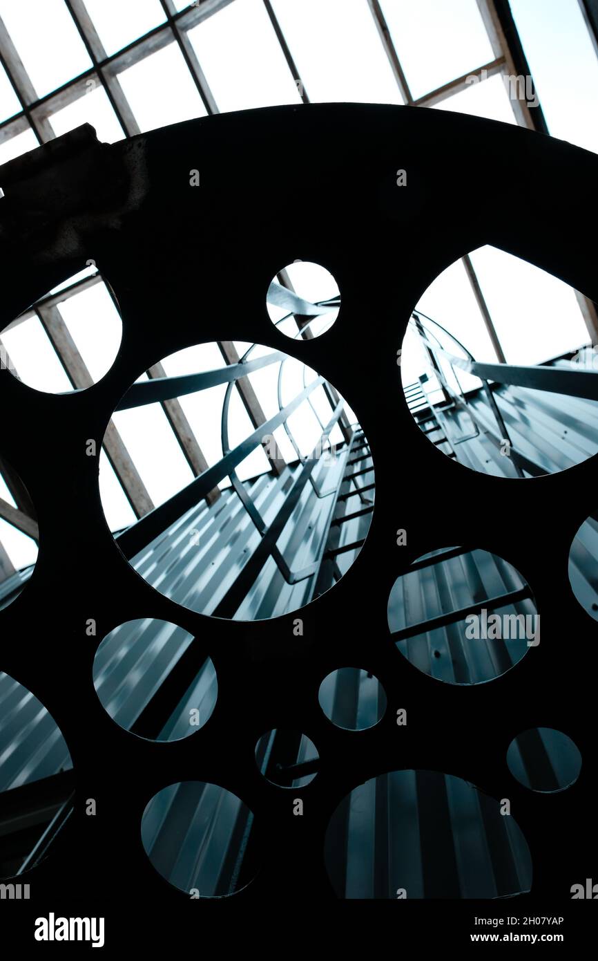 View of metal escape ladder through multiple circles. Abstract Stock ...