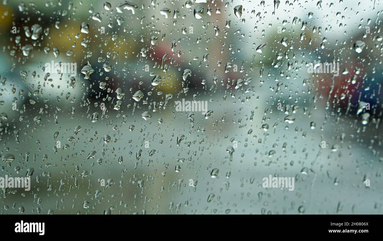Rain day abstract weather photo trough wet glass window Stock Photo - Alamy