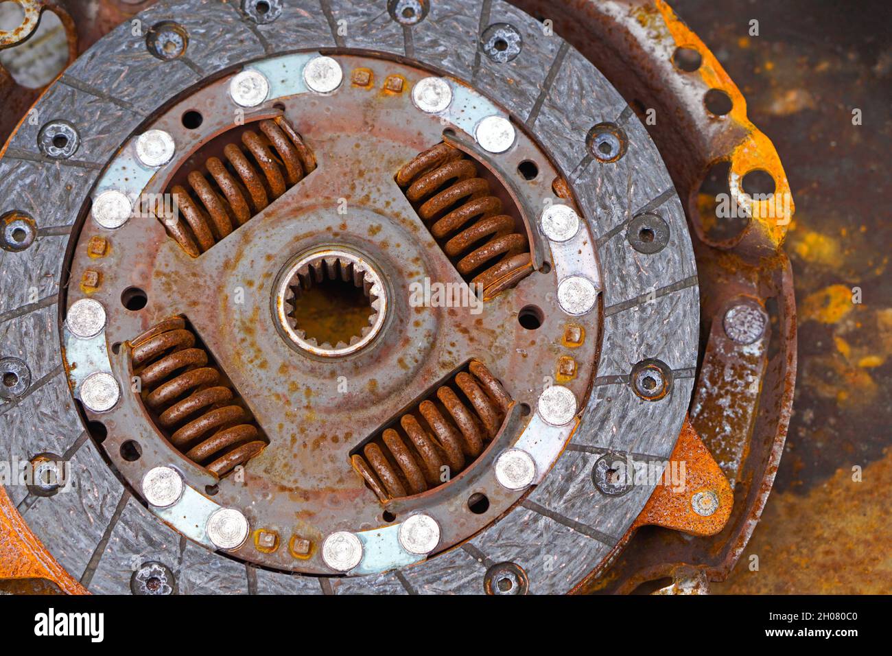 Rust old clutch disc car parts recycling Stock Photo - Alamy