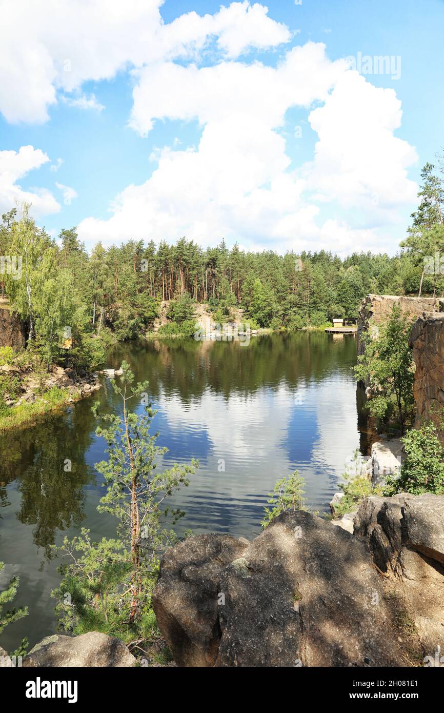 Beautiful landscape with forest and rocky mountain near lake. Camping ...