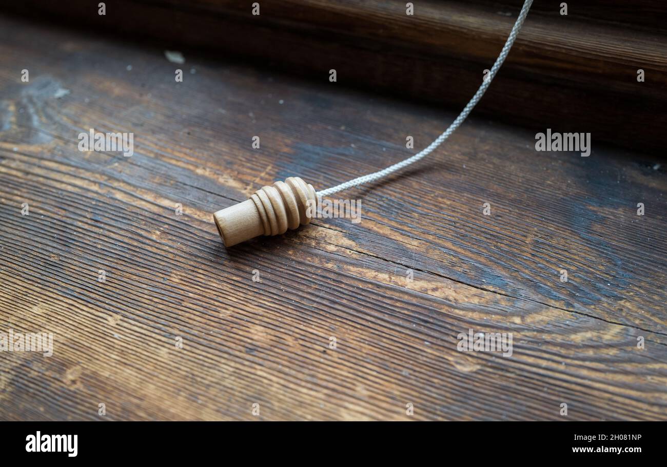 Carved wooden window blind knob with string Stock Photo - Alamy