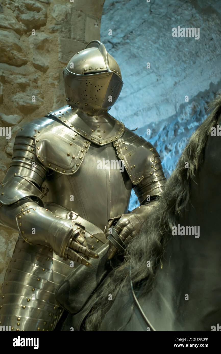 Medieval knight in armour on horseback displayed at the Tower of London ...