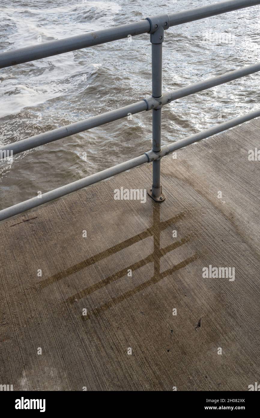Metal rail and its reflection on the pier at Skinningrove, North ...