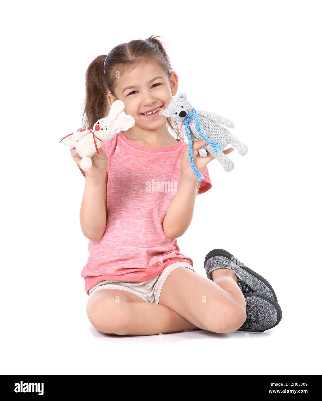 Little child playing with toy animals on white background. Indoor ...